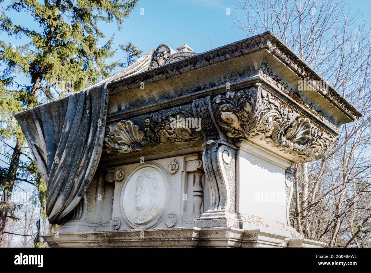 Old and weathered architectural column with beautiful carvings on ...