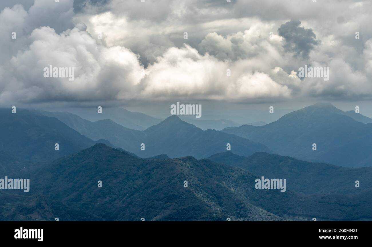 hill layers with its shadow and white cloud Stock Photo - Alamy