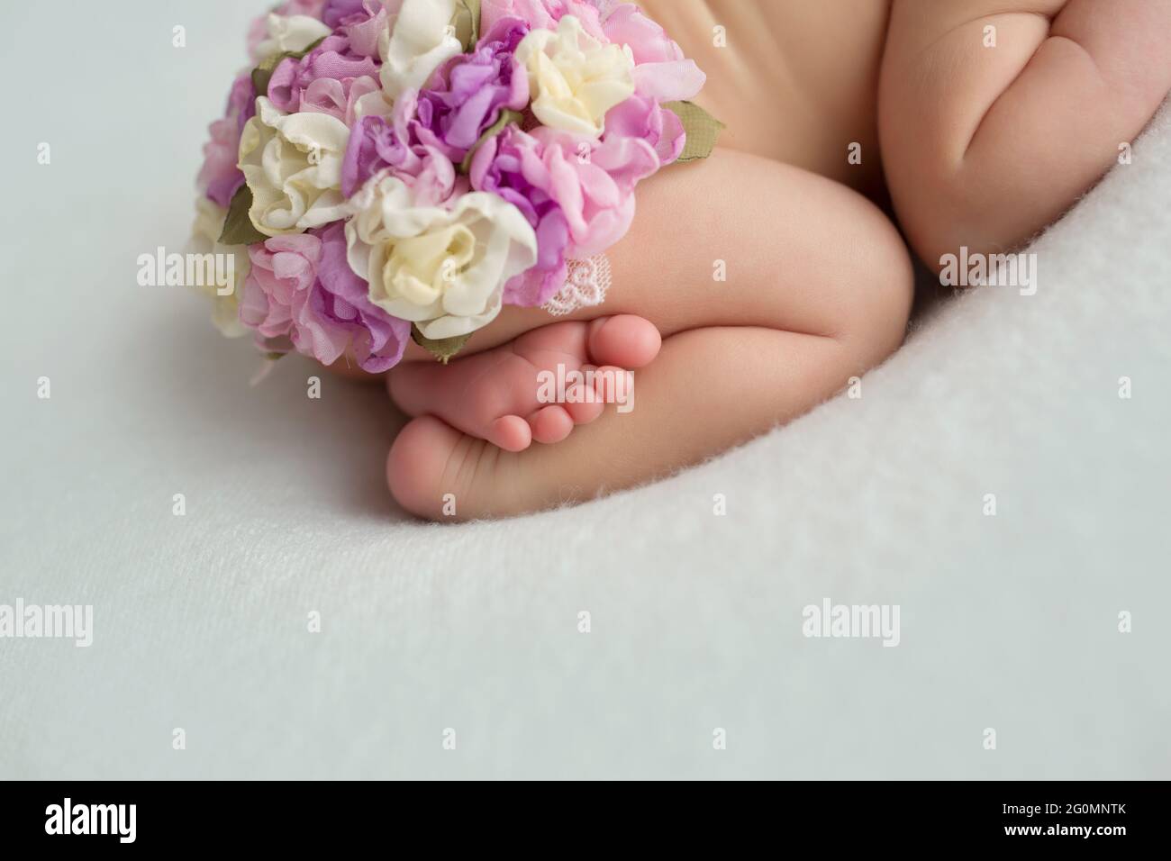 Baby feet. The tiny foot of a newborn in soft selective focus. Image of ...
