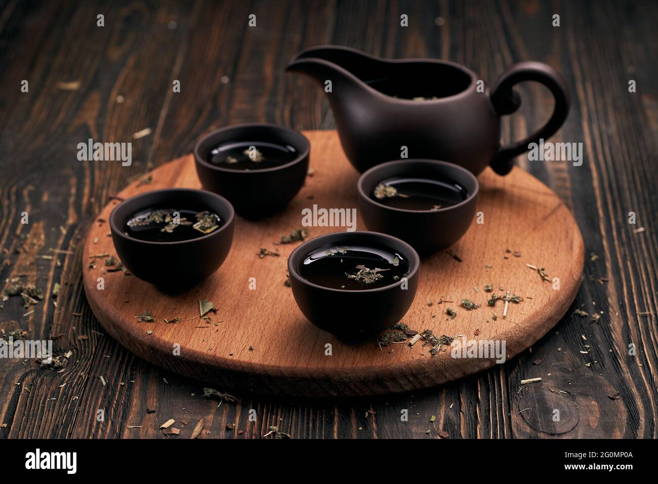 tea set and tea leaves on wooden kitchen board Stock Photo - Alamy