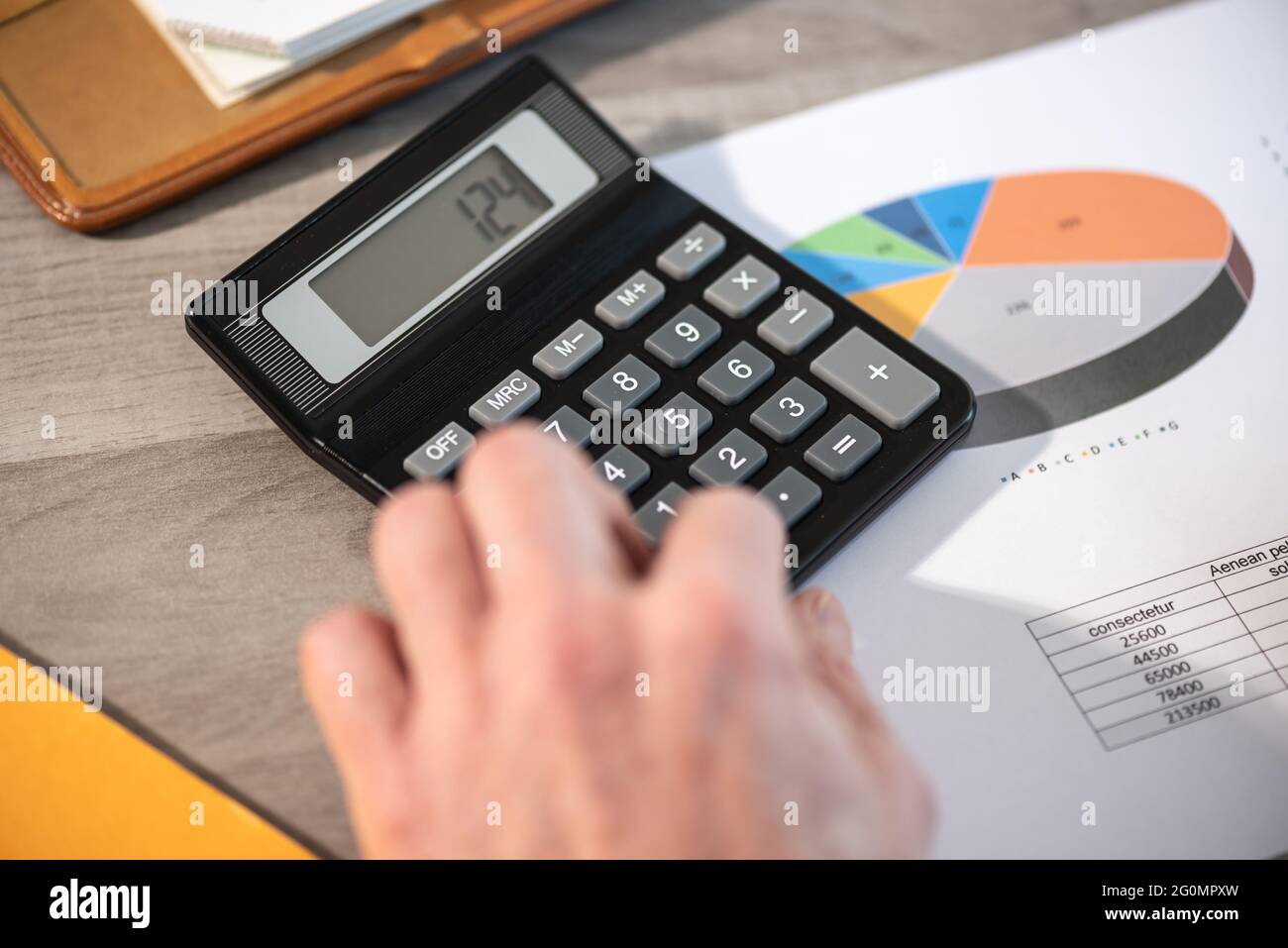 Data analysing hand calculator hi-res stock photography and images - Alamy