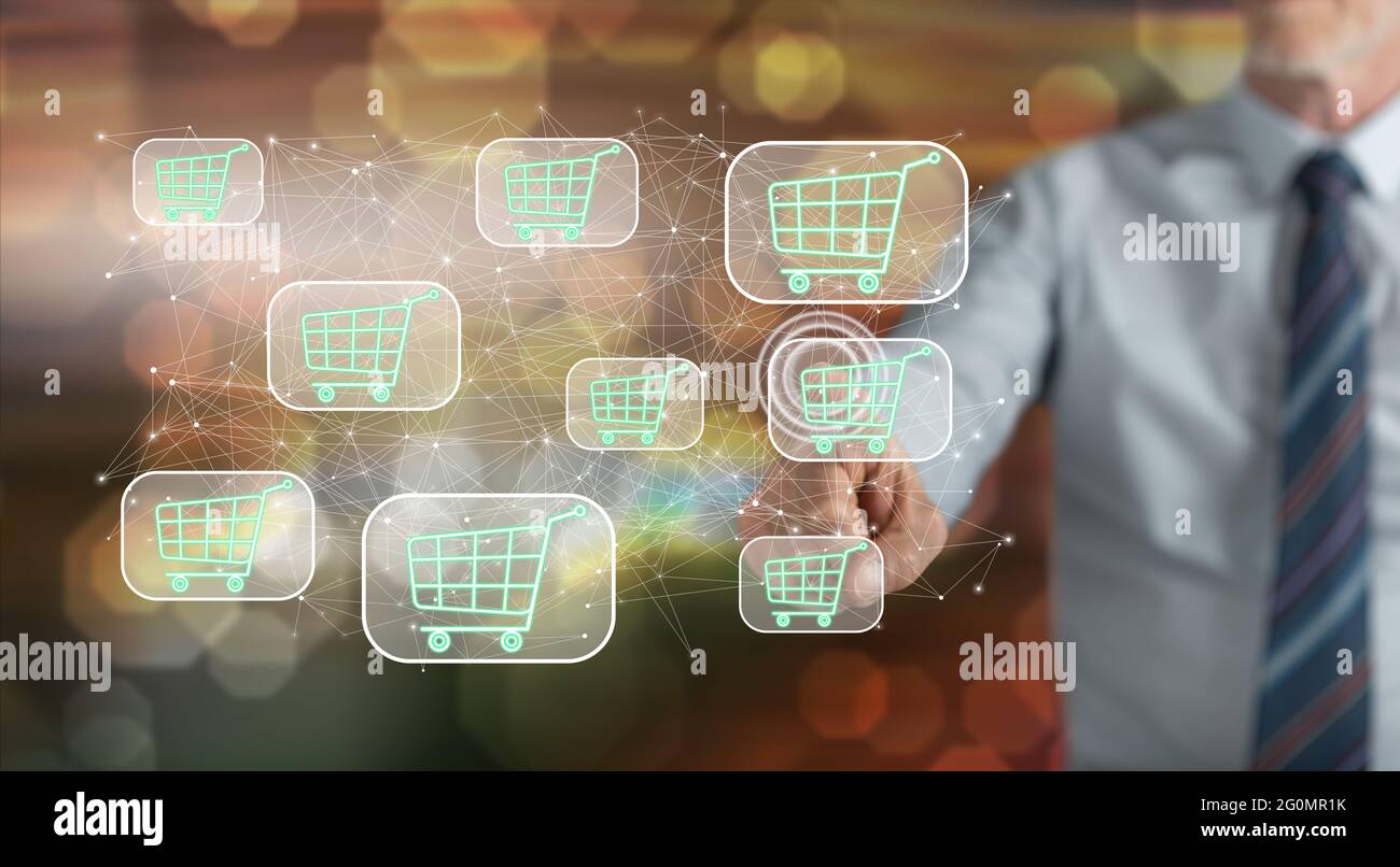 Man touching an online shopping concept on a touch screen with his ...