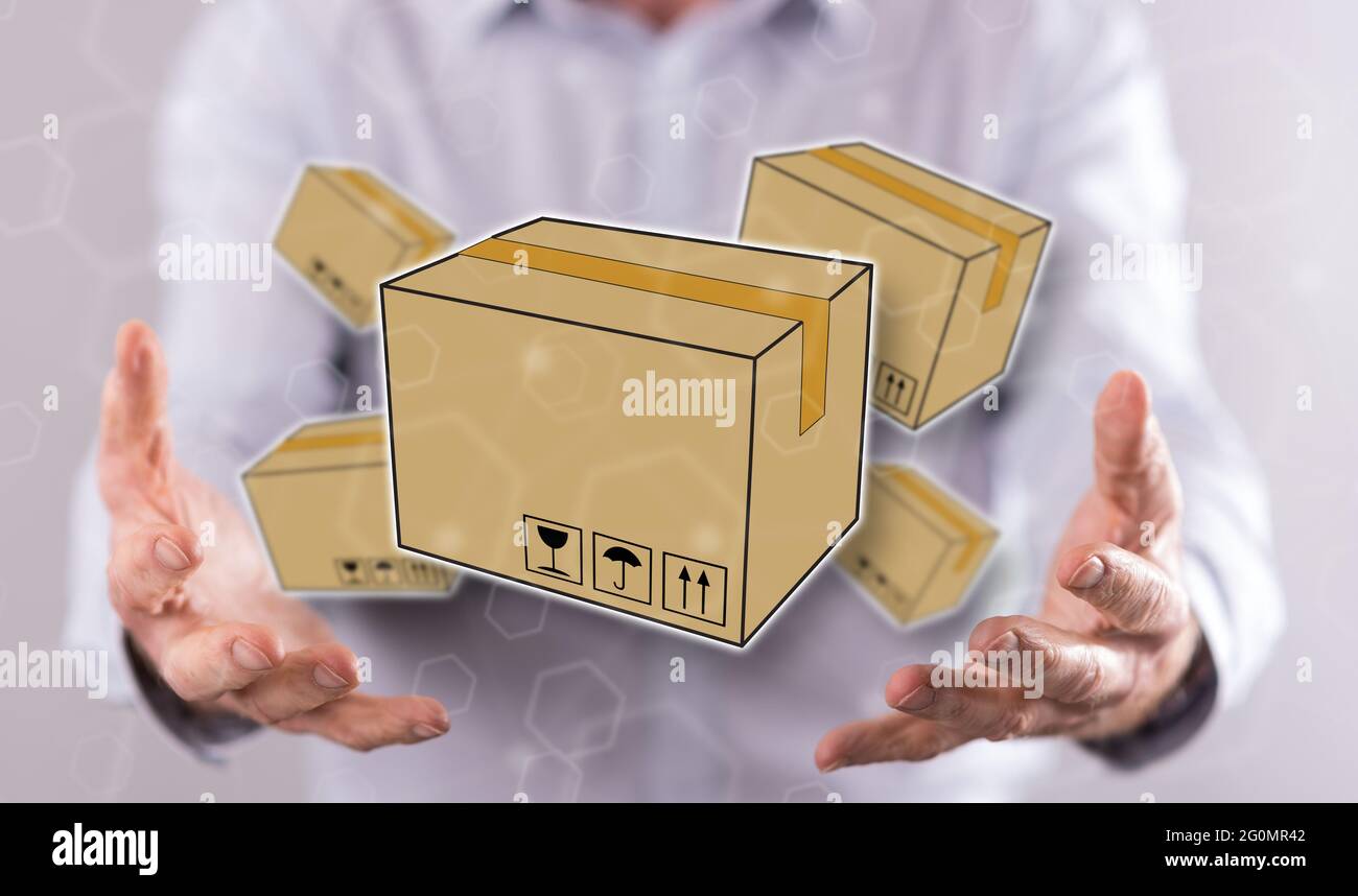 Packaging concept above the hands of a man in background Stock Photo ...