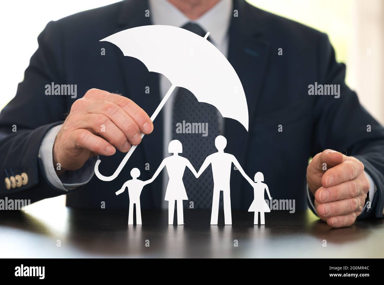 Symbol of family protection by a general agent Stock Photo - Alamy