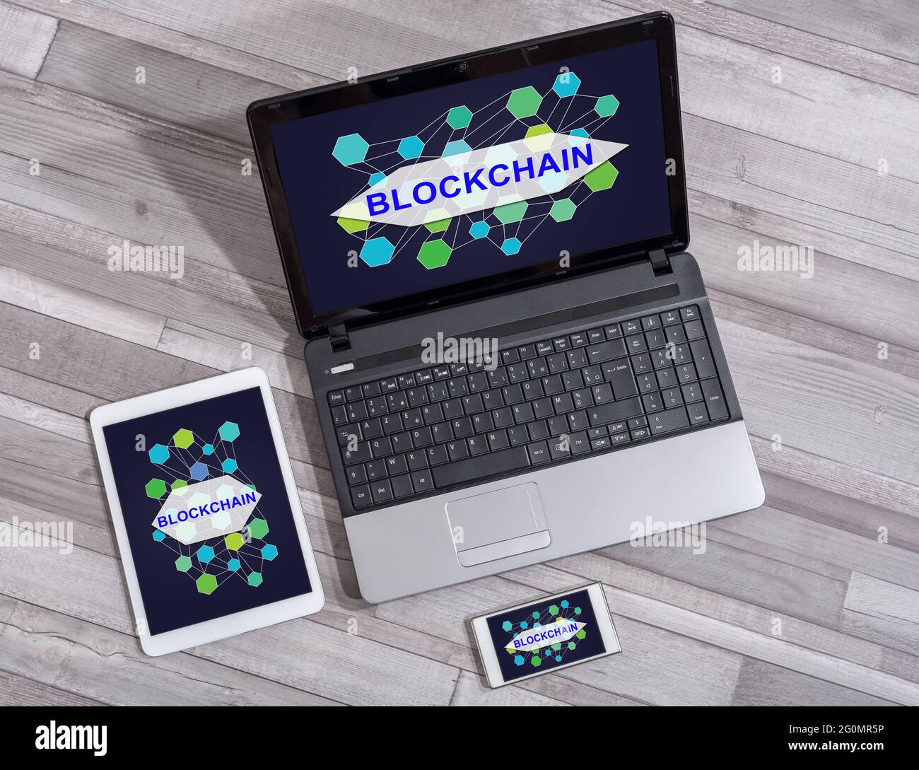 Blockchain concept shown on different information technology devices ...
