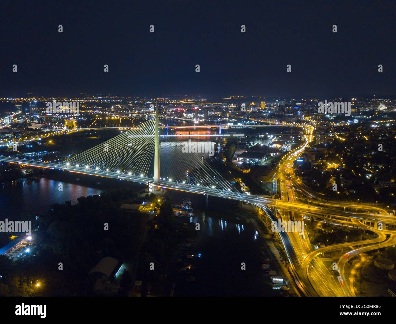 Night aerial view of Ada bridge and surrounding car interchange Stock ...