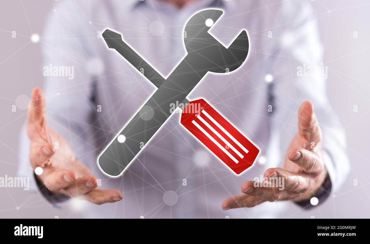 Maintenance service concept above the hands of a man in background ...