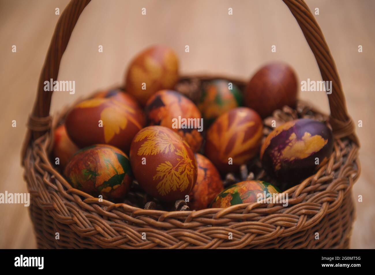 Closeup shot of colorful Easter eggs in a wooden basket Stock Photo - Alamy