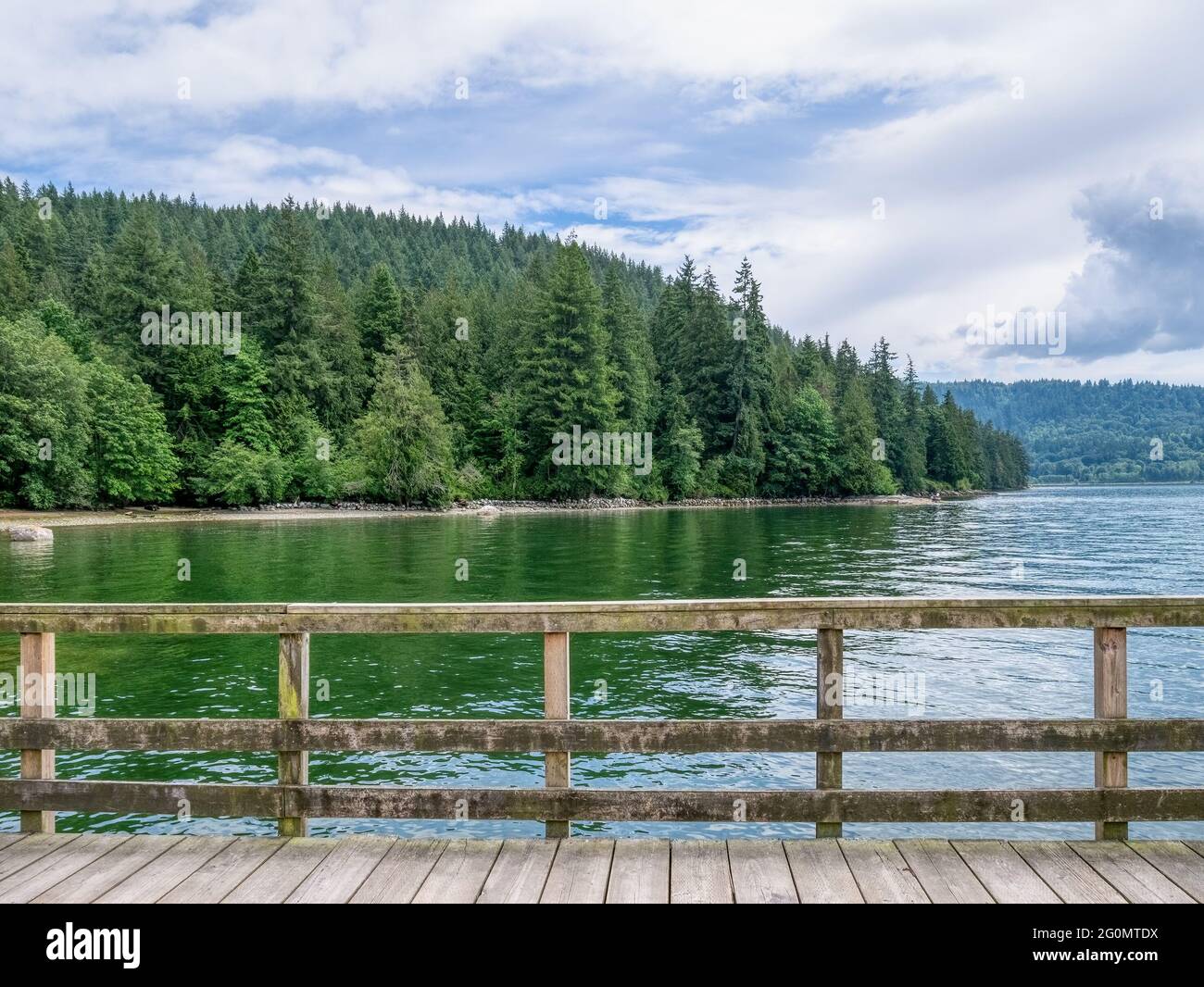 Overview of an ocean bay from the wooden pier Stock Photo - Alamy