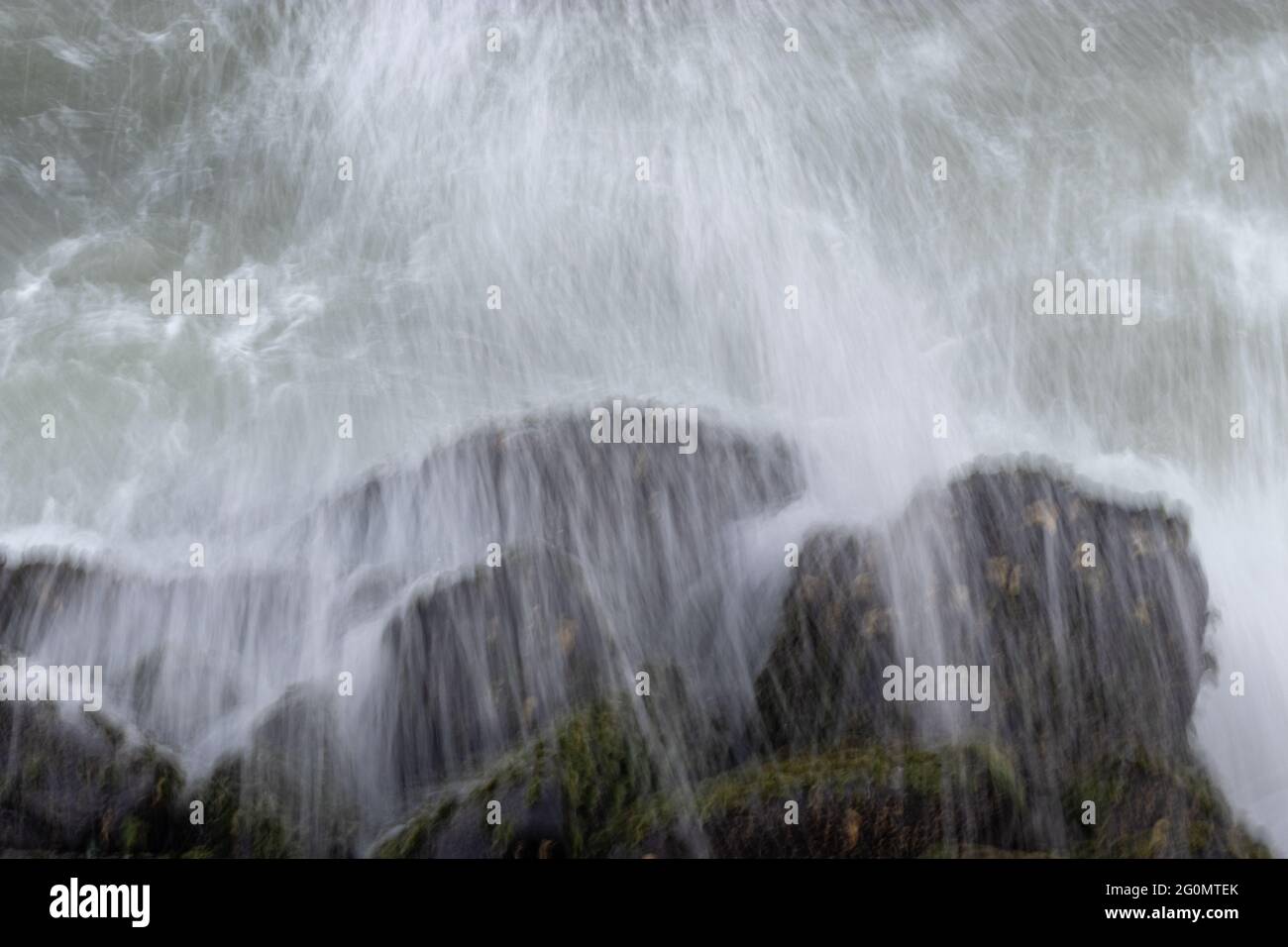 Waves splashing on rough rocks hi-res stock photography and images - Alamy