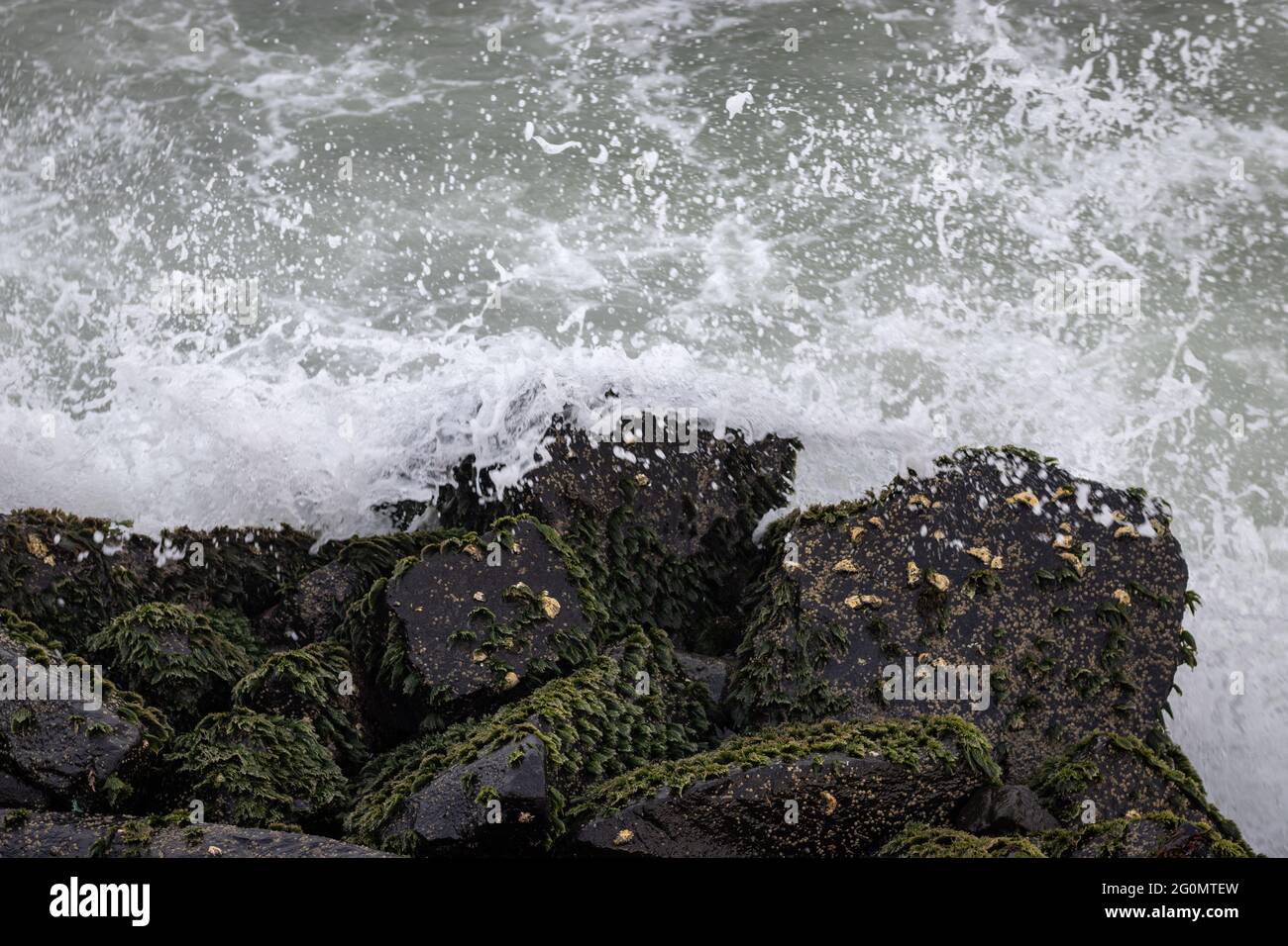 sea waves splash on seaside rocks Stock Photo - Alamy