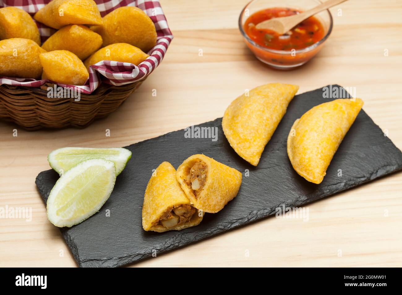 Tasty empanadas - Colombian cuisine; photo on wooden background Stock ...