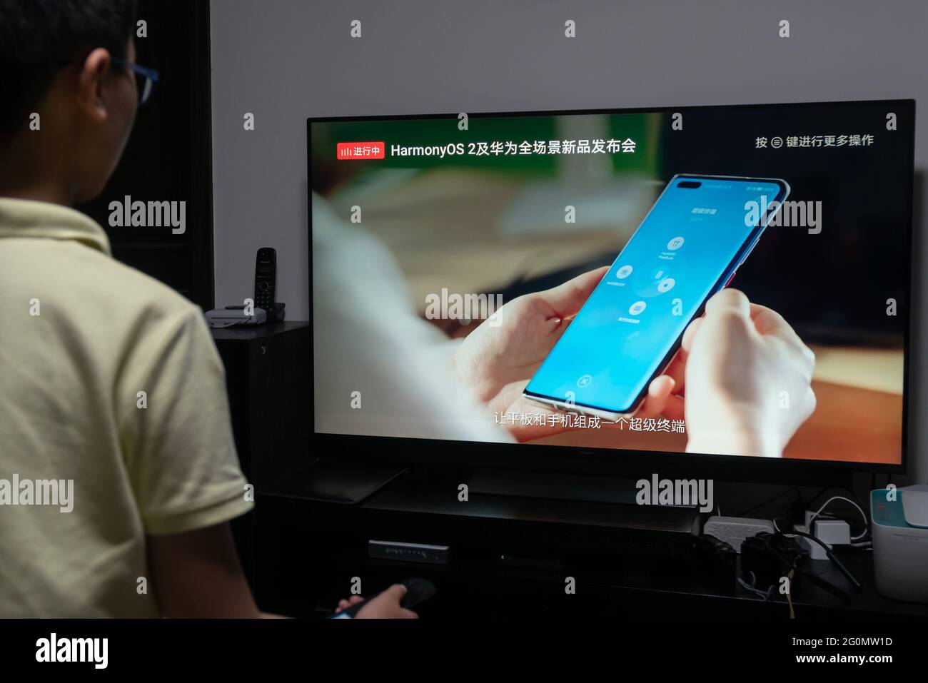 SHANGHAI, CHINA - JUNE 2, 2021 - A teenager watches the Harmony OS (Hongmeng System) and Huawei ...