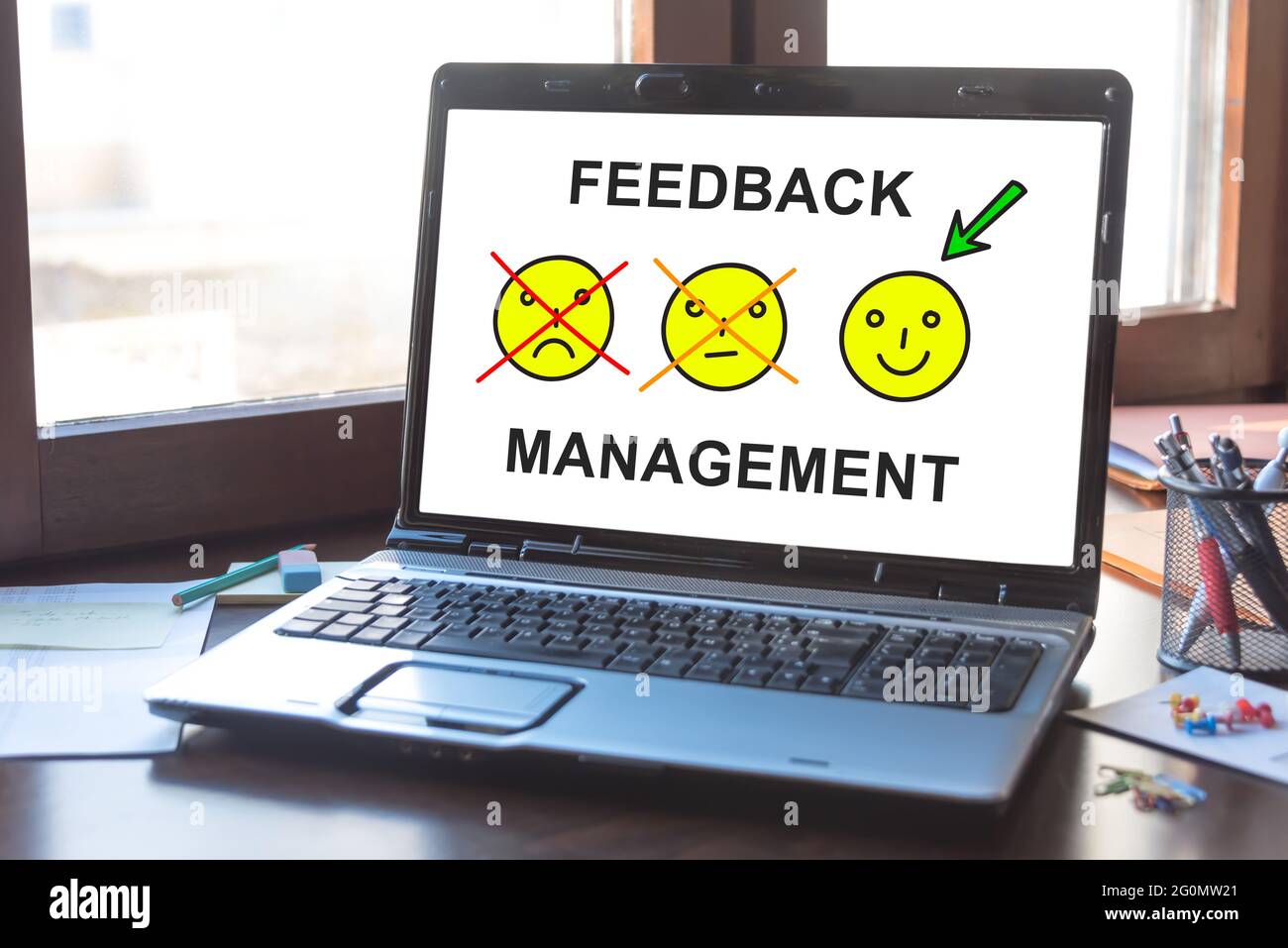 Laptop screen displaying a feedback management concept Stock Photo - Alamy