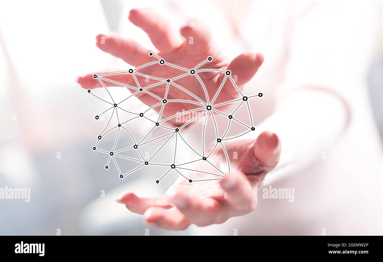 Virtual network concept between hands of a woman in background Stock ...