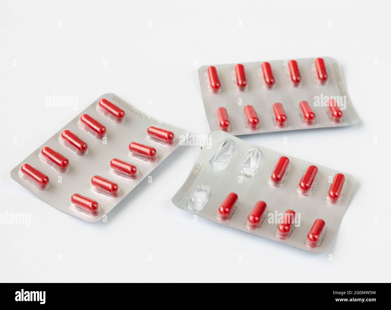 Red capsules in blister - tabletted medicinal substance Stock Photo - Alamy