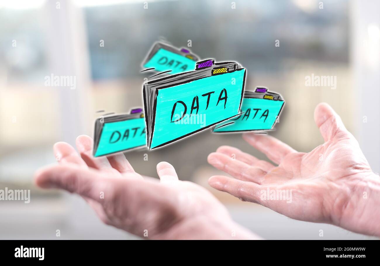 Data concept above the hands of a man Stock Photo - Alamy