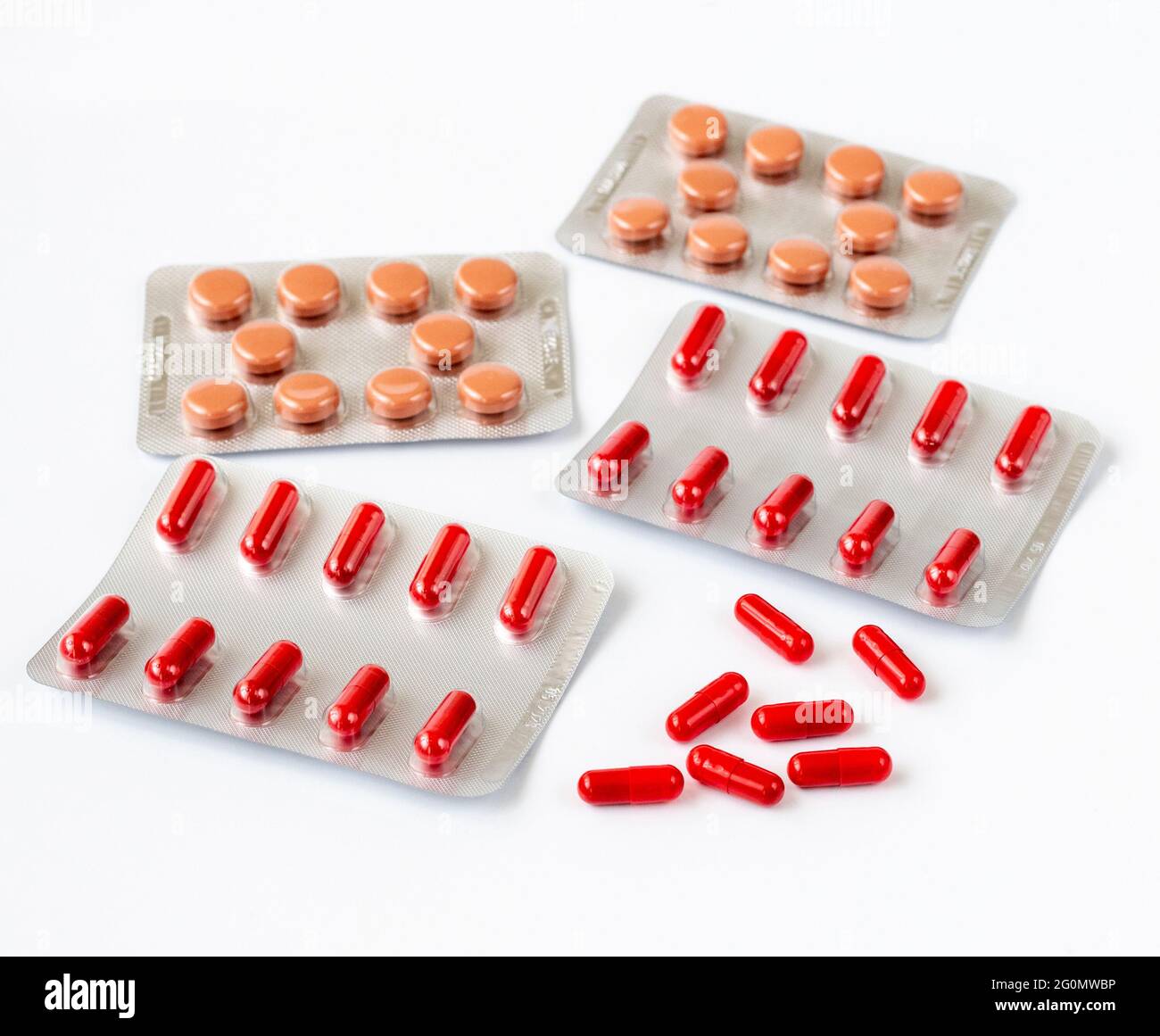 Red capsules in blister - tabletted medicinal substance Stock Photo - Alamy
