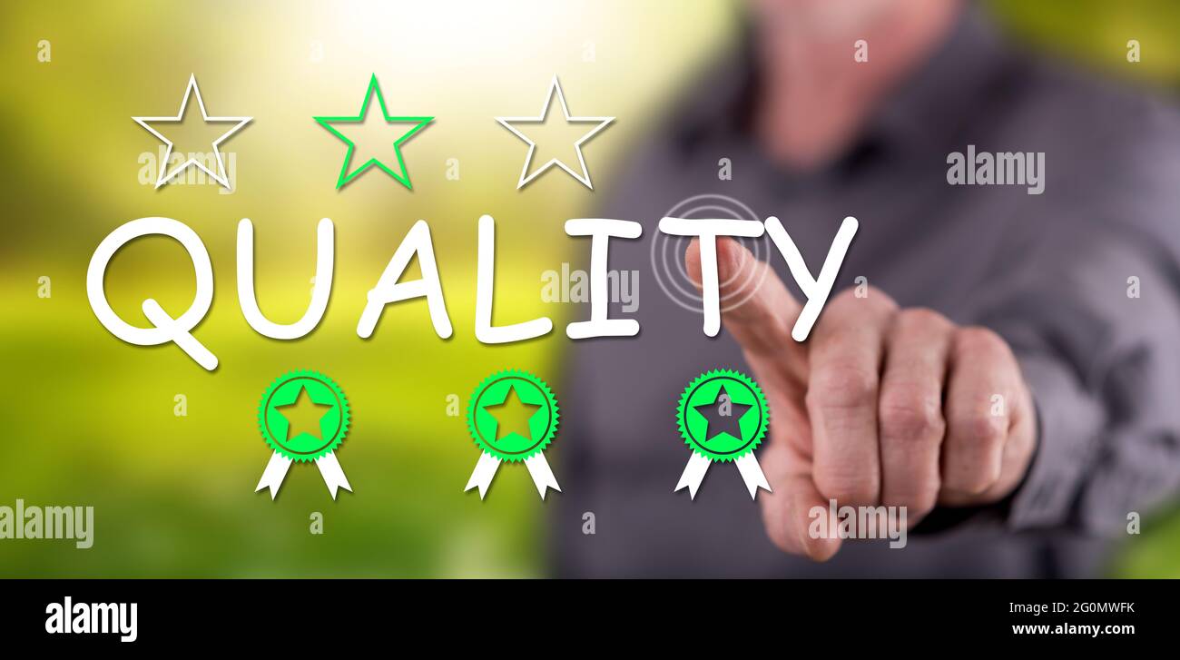 Man touching a quality concept on a touch screen with his finger Stock ...