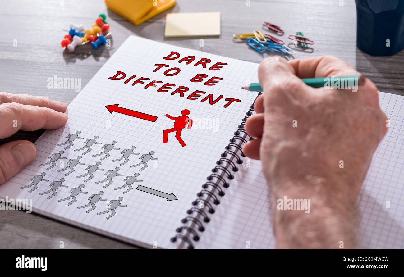 Hand drawing dare to be different concept on a notepad Stock Photo - Alamy