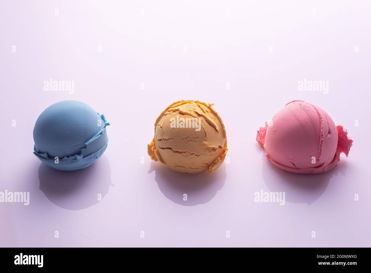 set of colored balls of ice cream on a white background Stock Photo - Alamy