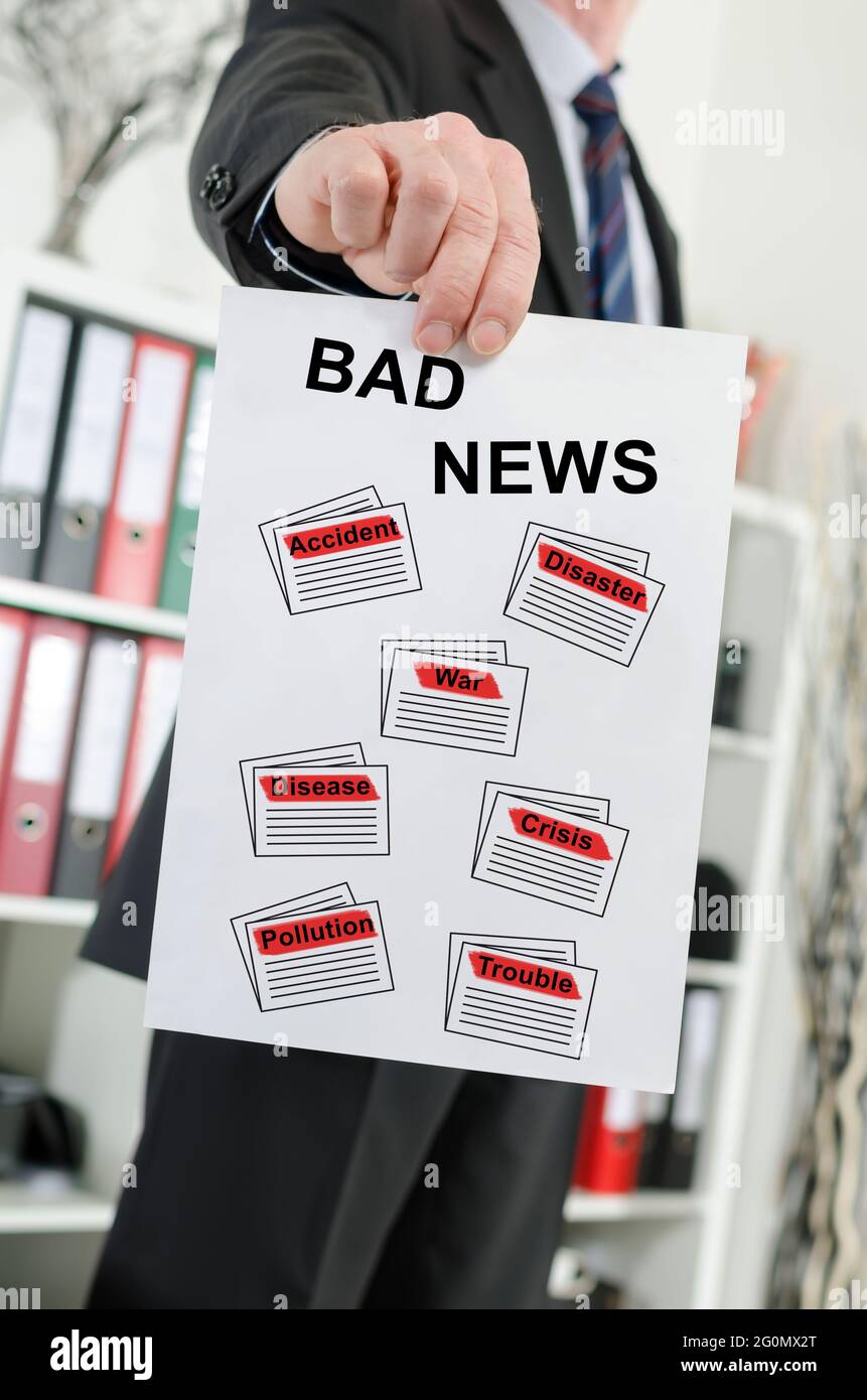 Paper showing bad news concept held by a businessman Stock Photo - Alamy