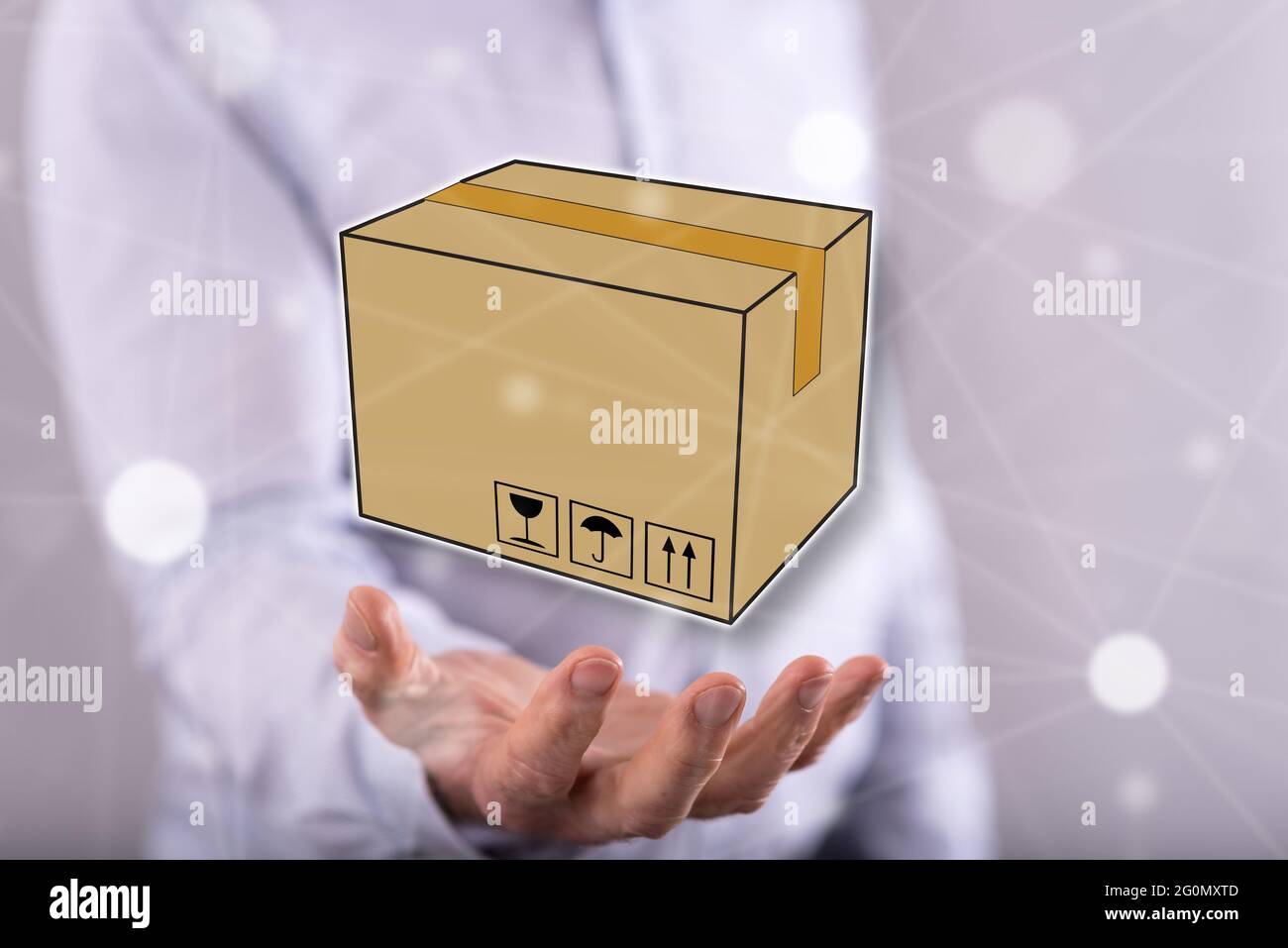 Packaging concept above the hand of a man in background Stock Photo - Alamy