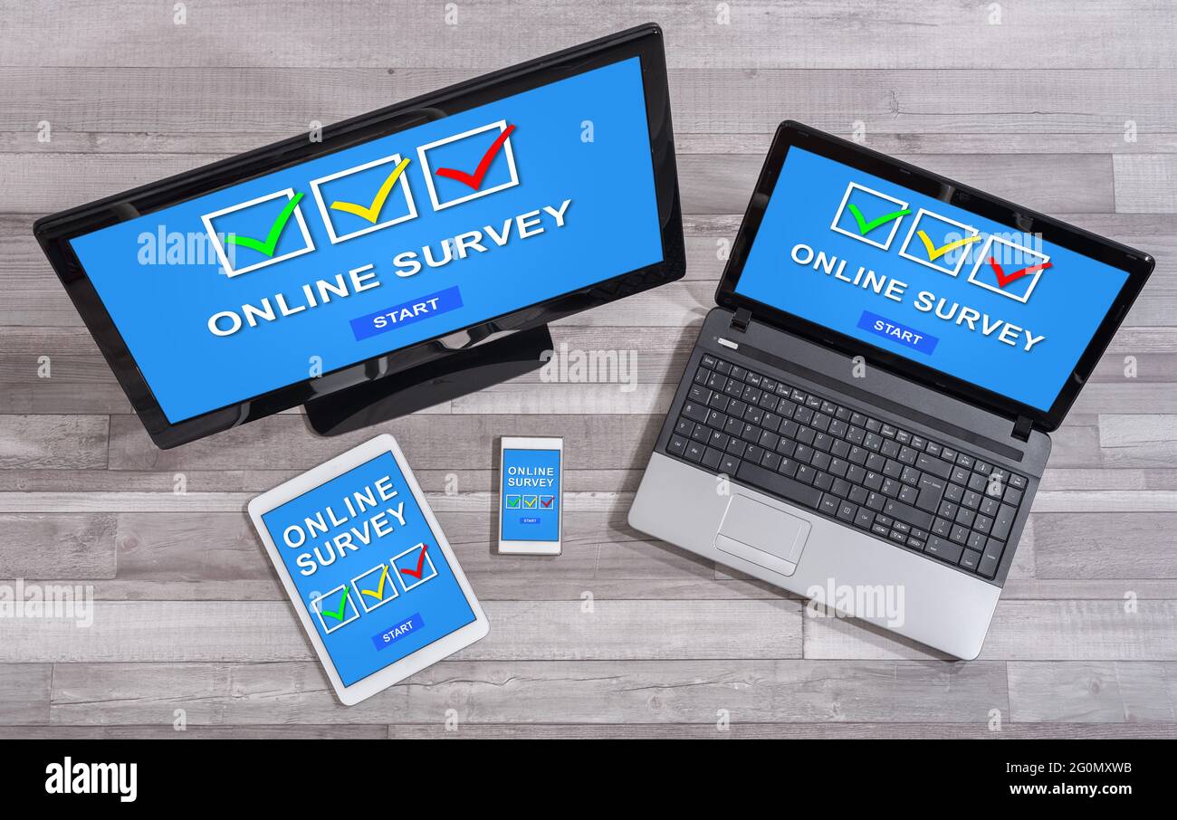 Online survey concept shown on different information technology devices ...