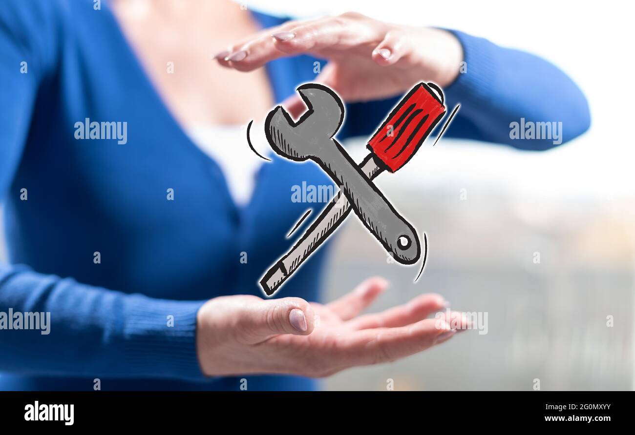 Maintenance service concept between hands of a woman in background ...