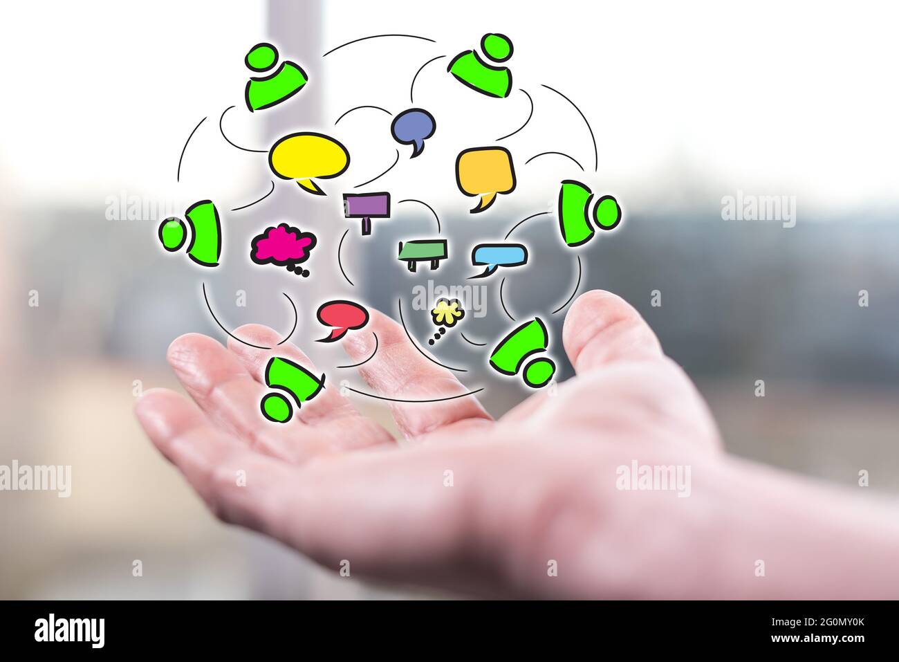 Communication concept above a hand of a man Stock Photo - Alamy