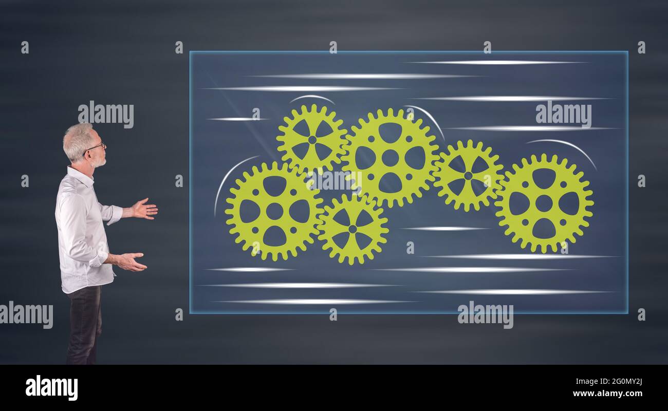 Businessman showing a teamwork concept on a wall screen Stock Photo - Alamy