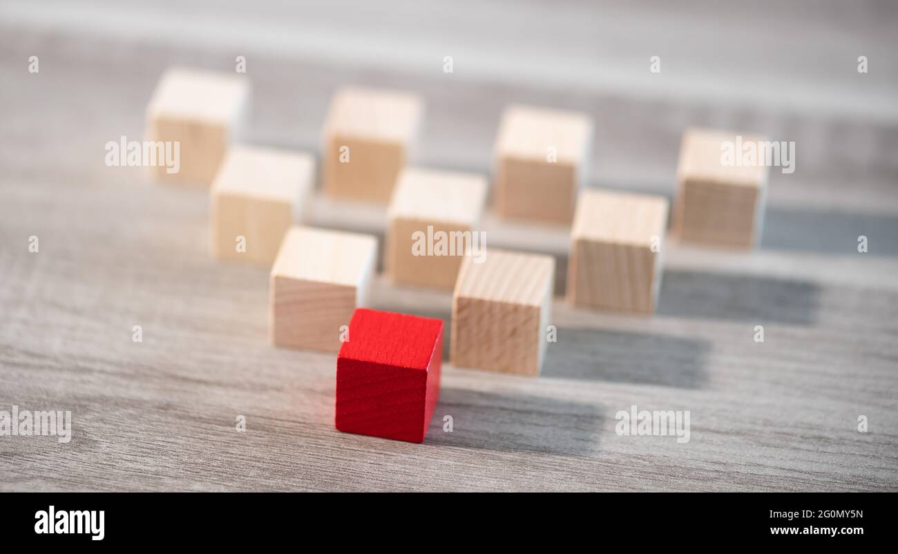 Concept of leadership with wooden cubes Stock Photo - Alamy