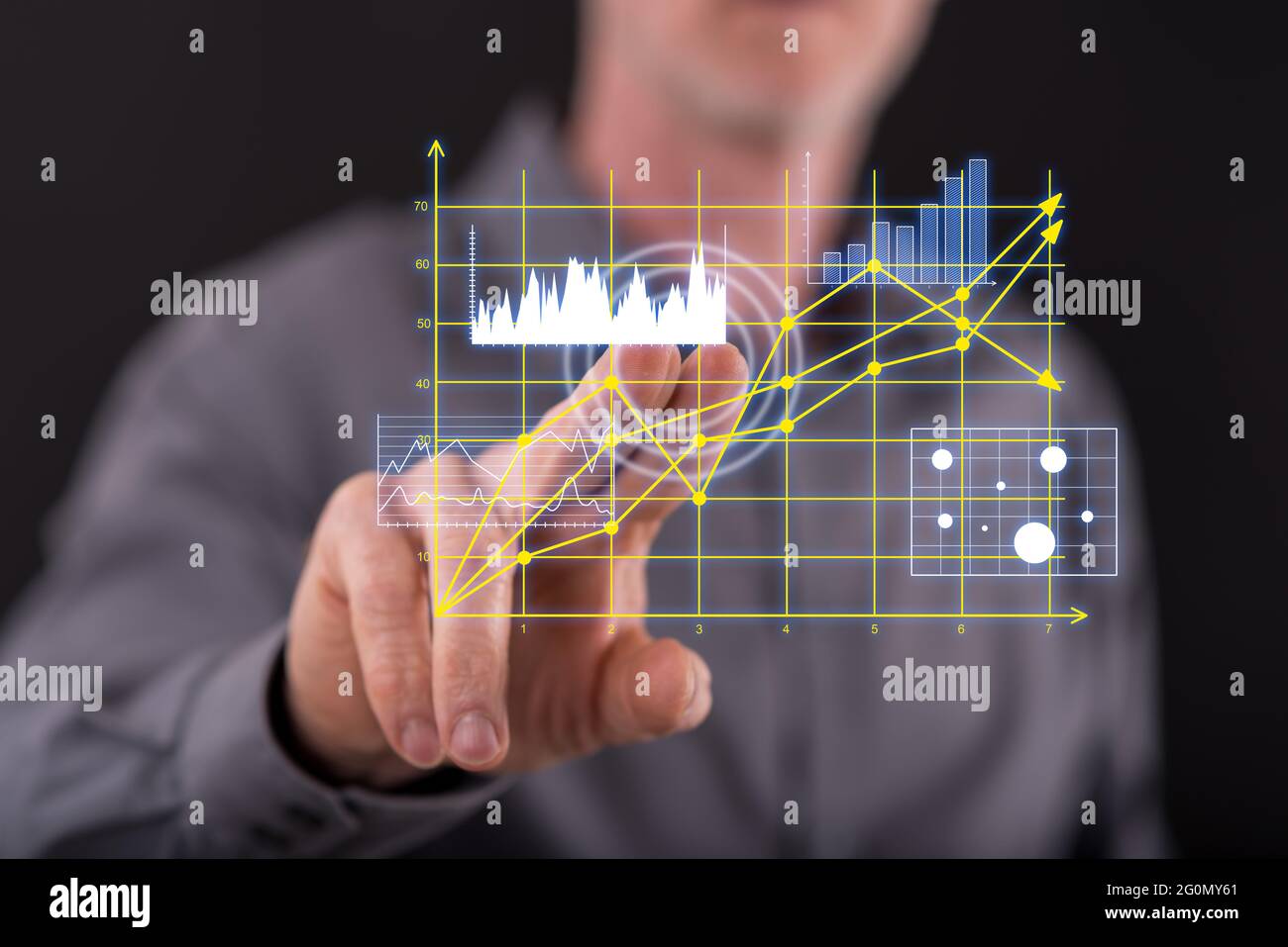 Man touching business charts on a touch screen with his finger Stock ...