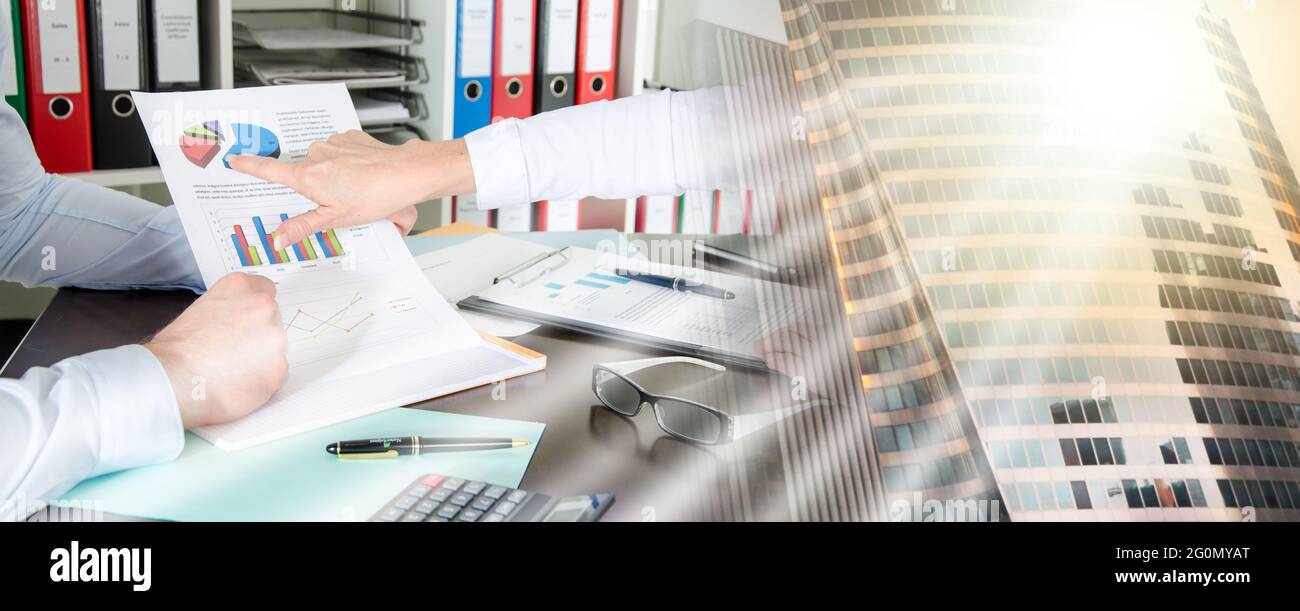 Two business people analyzing charts; multiple exposure Stock Photo - Alamy