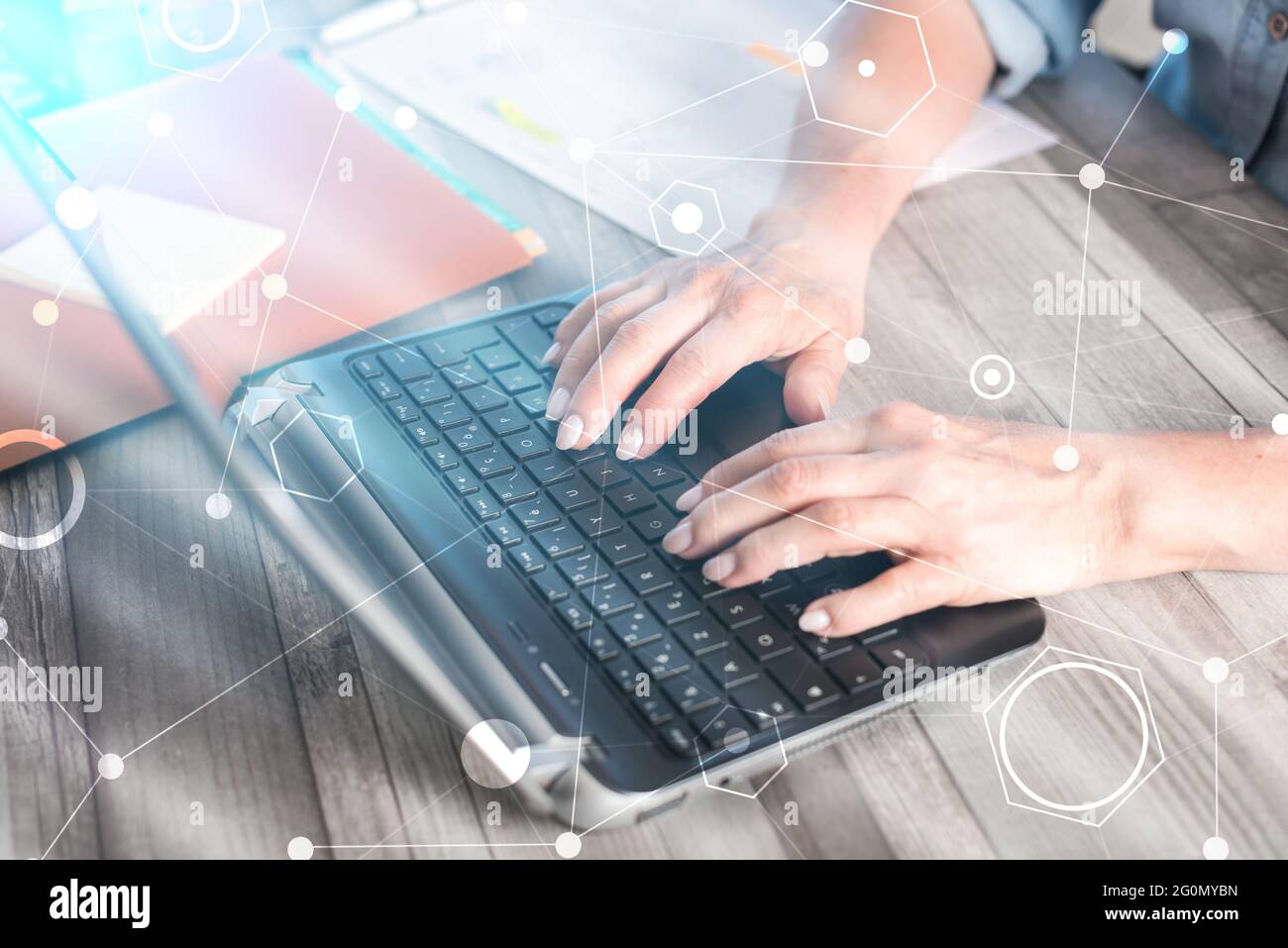 Female hands using a laptop in office, light effect Stock Photo - Alamy