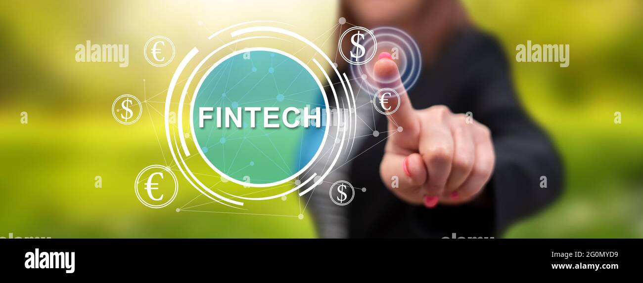 Woman touching a fintech concept on a touch screen with her finger ...