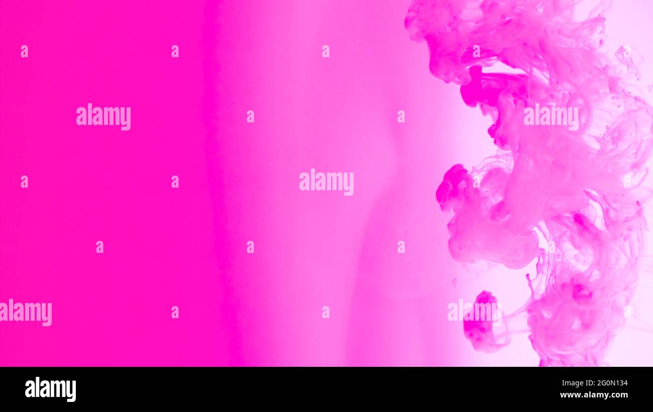 Image of pink ink flowing in water Stock Photo - Alamy