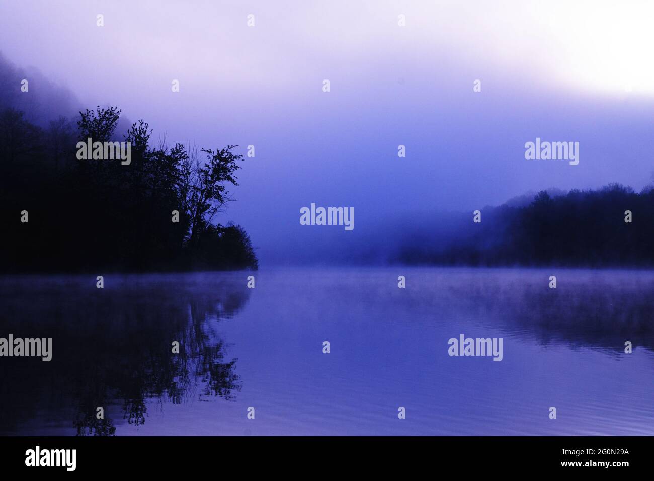 Magical morning fog over a lake Stock Photo - Alamy