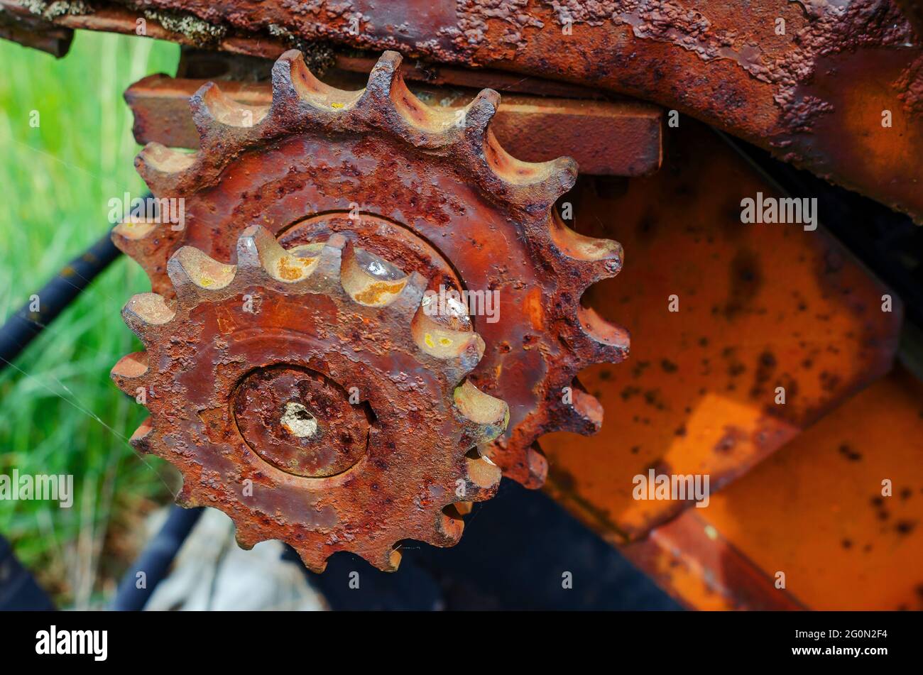 Rusty old metal gears in broken combine unit Stock Photo - Alamy