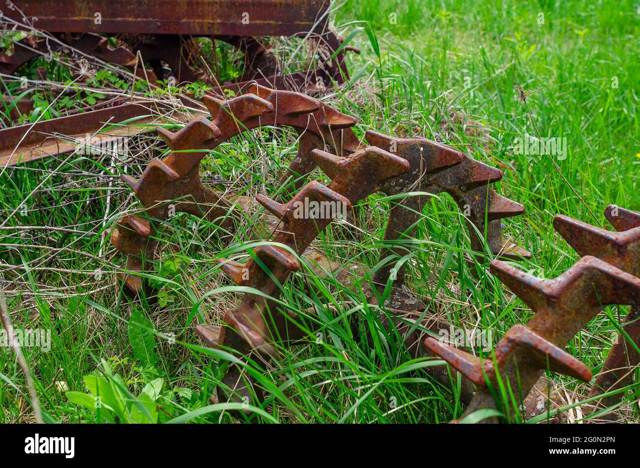 Old rusty plows in the grass abandoned on field Stock Photo - Alamy