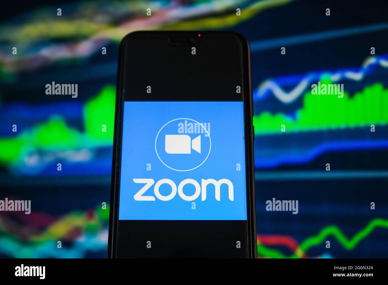 In this photo illustration a Zoom logo is displayed on a smartphone ...