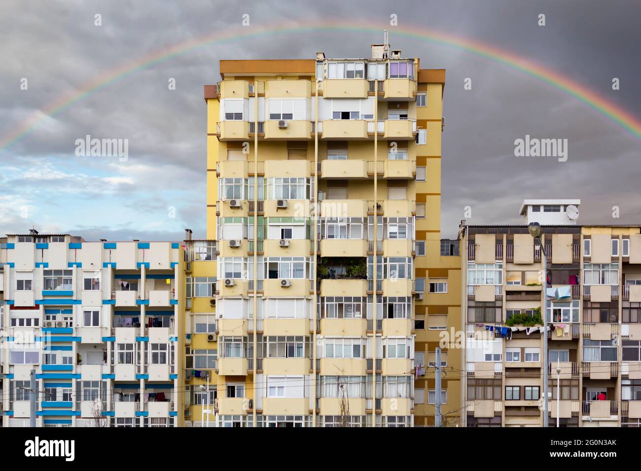 Building exterior and sky with rainbow Stock Photo - Alamy