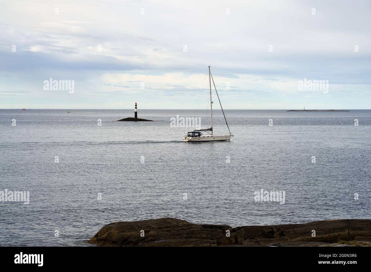 VEVANG, NORWAY - Jul 28, 2020: A family is enjoying a boat trip between ...