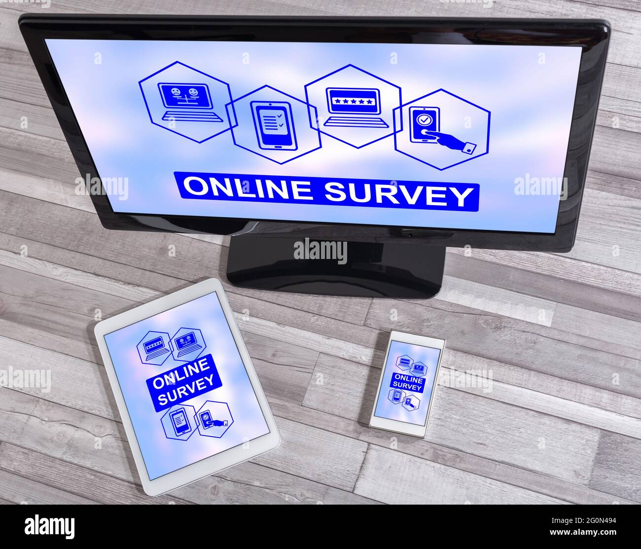 Online survey concept shown on different information technology devices ...