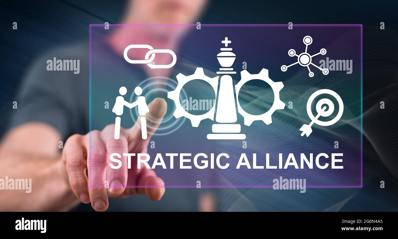 Man touching a strategic alliance concept on a touch screen with his ...