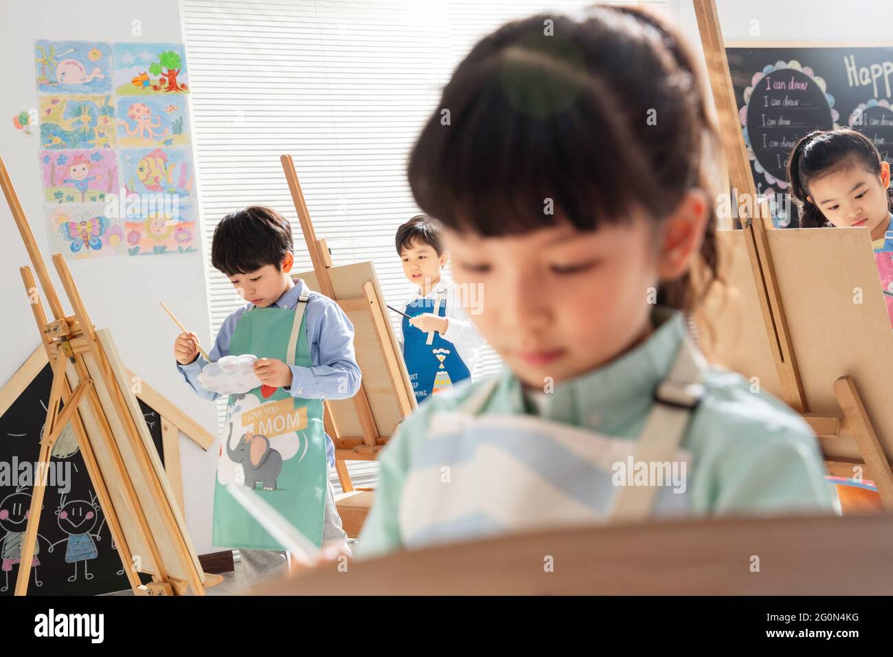 Children learning to paint Stock Photo - Alamy