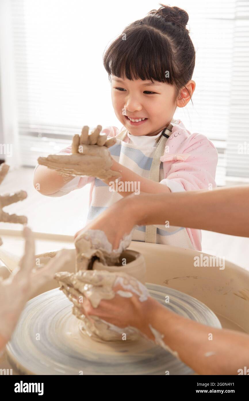 Happy children handmade pottery class Stock Photo - Alamy