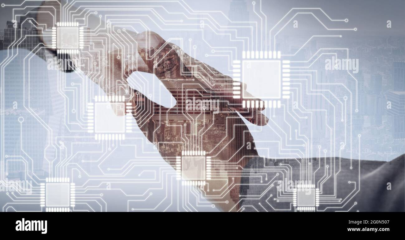 Composition of computer circuit board over handshake and cityscape ...
