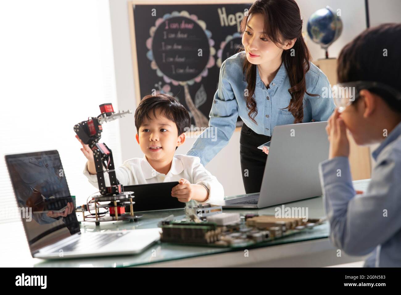 Students learning robot programming Stock Photo - Alamy