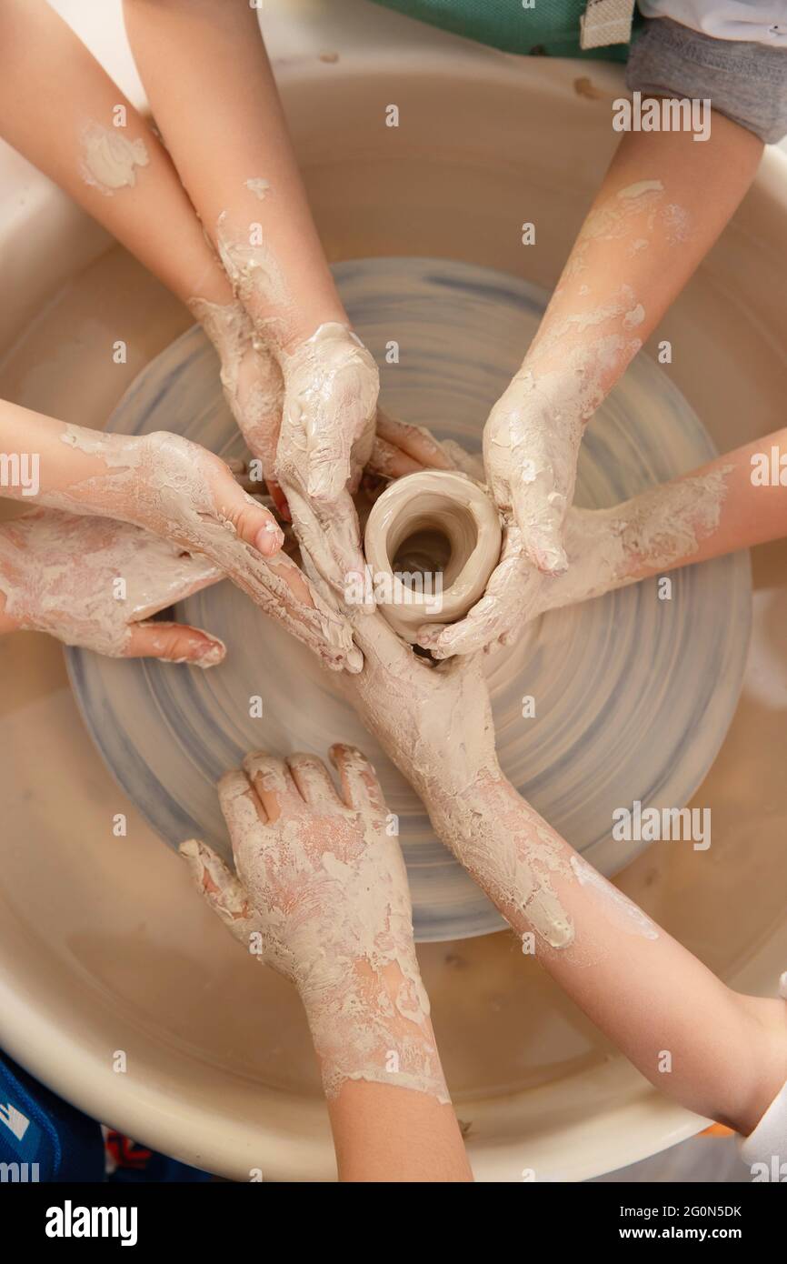 Happy children handmade pottery class Stock Photo - Alamy